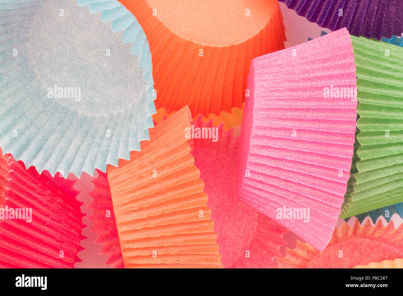 Colorful paper baking cases filling the frame in a bakery or baking ...