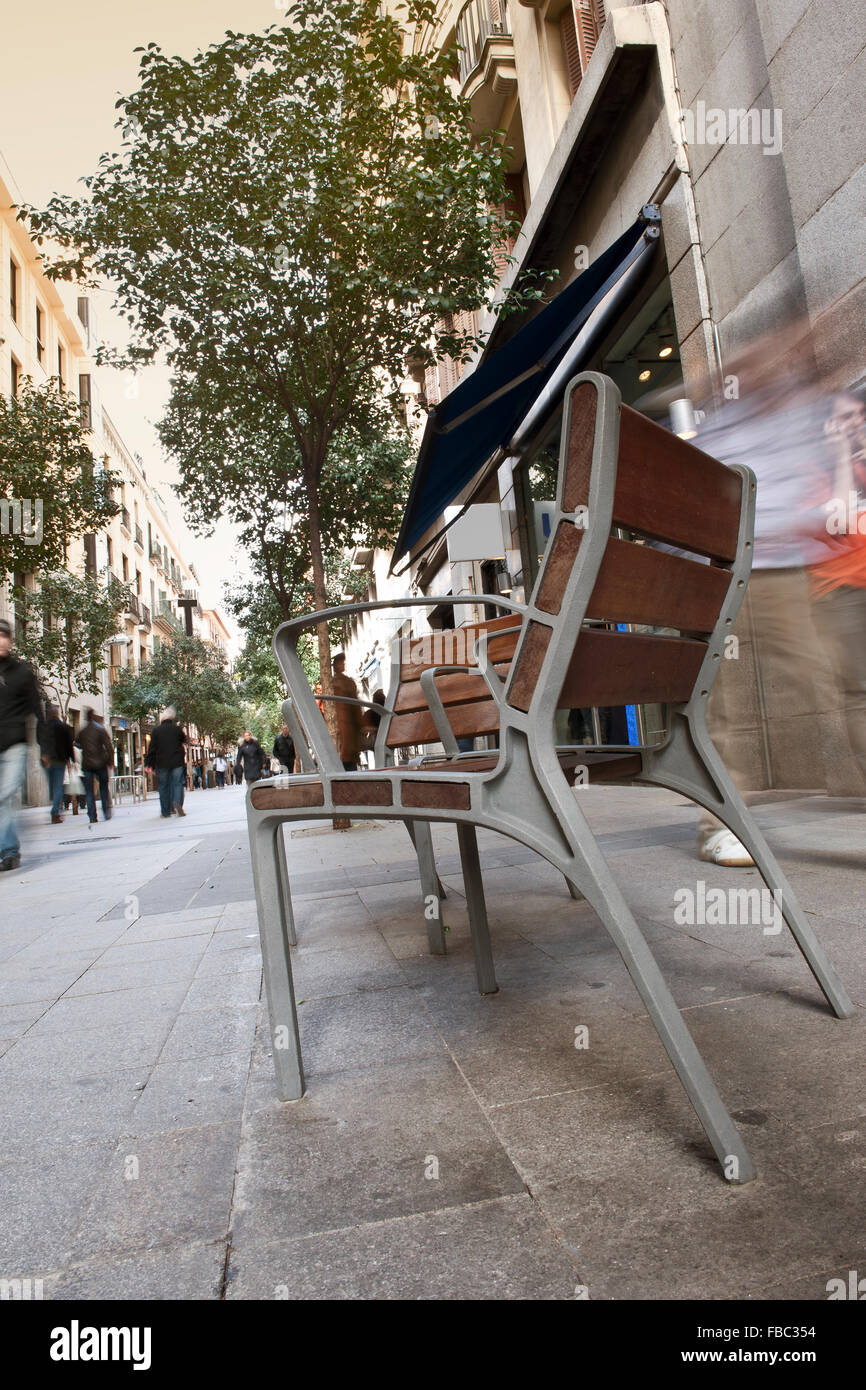 Street furniture. Wooden chair. City. Vertical Stock Photo - Alamy