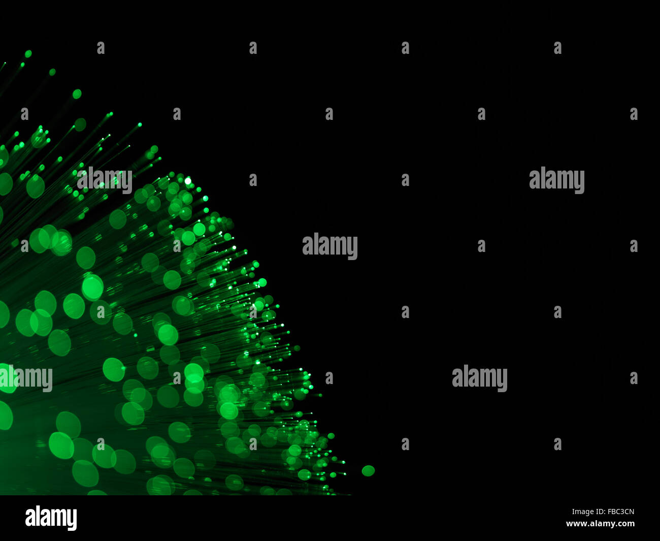 Green Fibre Optic cable isolated against black Stock Photo - Alamy