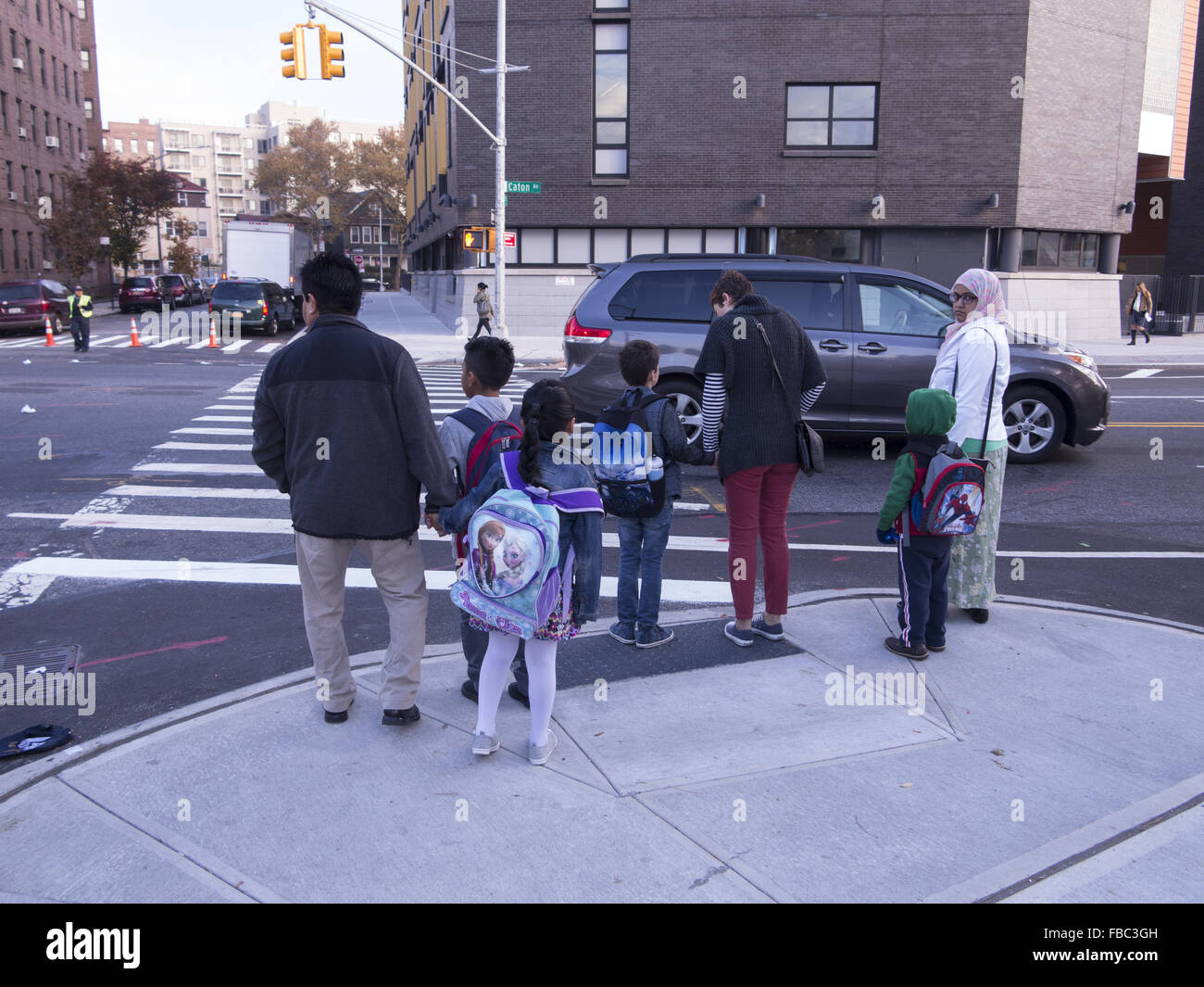 Parents walking their children to school in the multiethnic Kensington ...