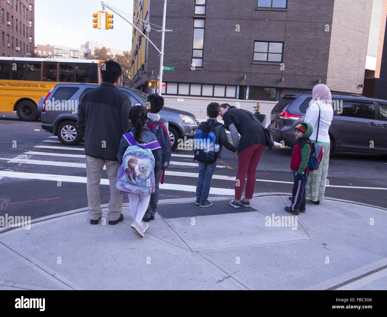 Parents walking their children to school in the multiethnic Kensington ...
