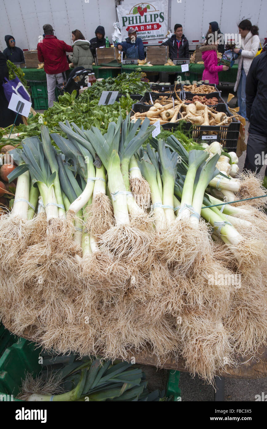 Beautiful leeks on display as people shop at the Grand Army Plaza ...