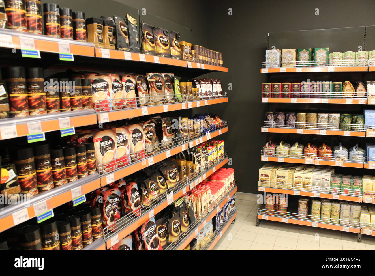 shop with a lot of different kinds of coffee packets on the shelves in ...