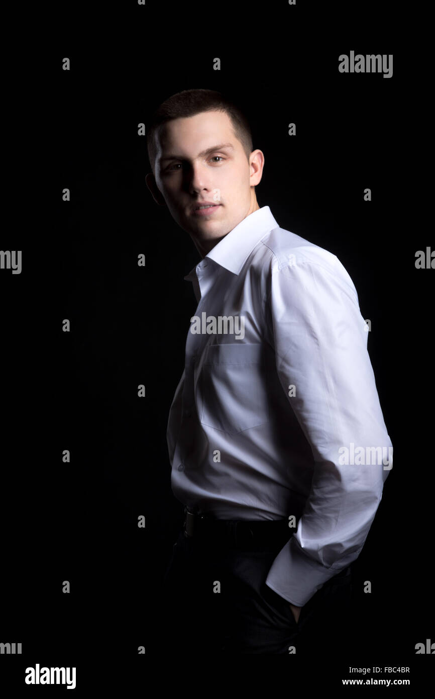Portrait of handsome confident young man in white shirt Stock Photo - Alamy