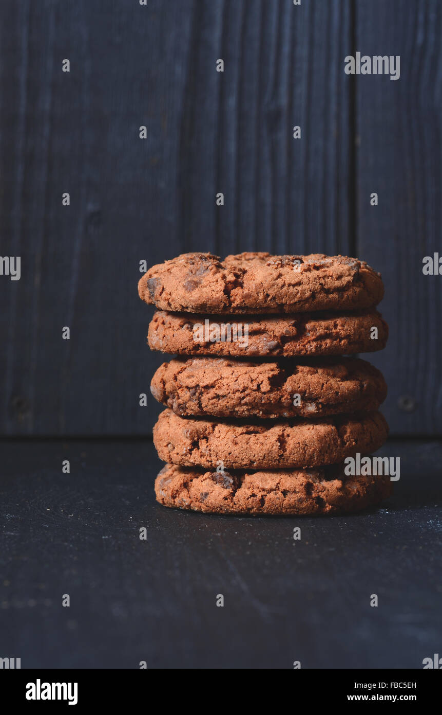 Chocolate chip cookies on dark background Stock Photo - Alamy