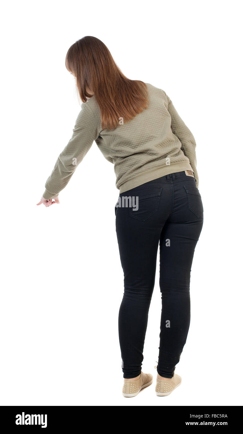 Back view of pointing woman. beautiful girl. Rear view people ...