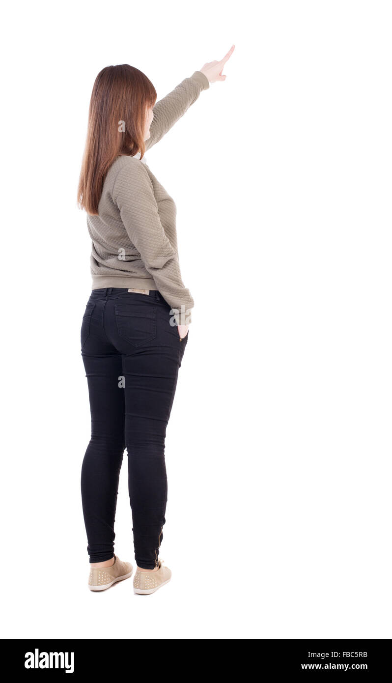Back view of pointing woman. beautiful girl. Rear view people ...