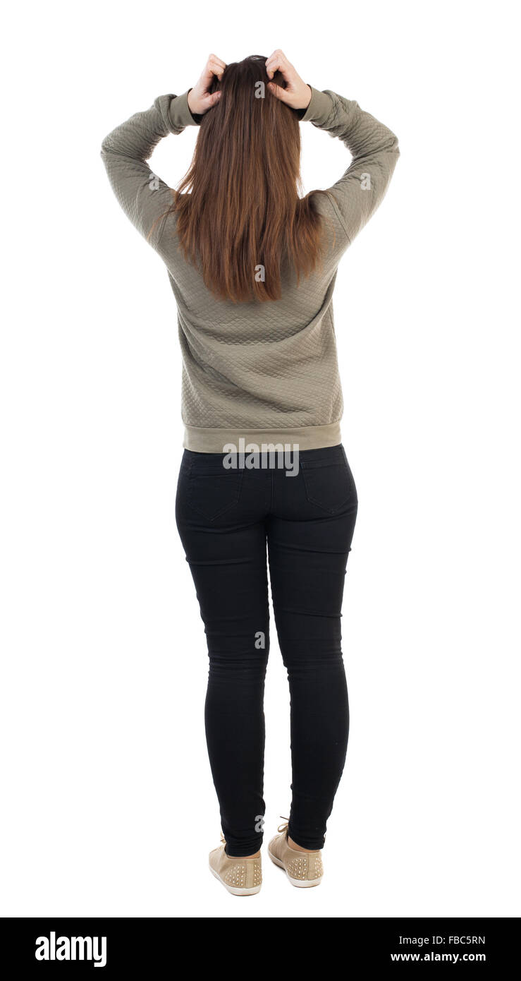 back view of standing young beautiful woman. Girl scratching head. Rear ...