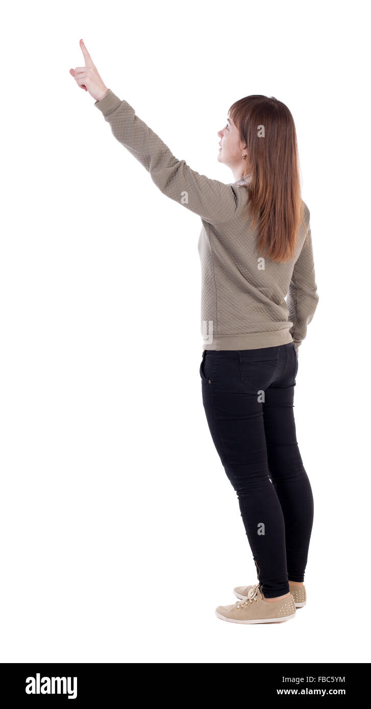 Back view of pointing woman. beautiful girl. Rear view people ...