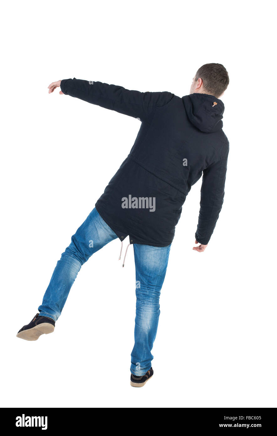 Balancing young man or dodge falling man. Rear view people collection ...