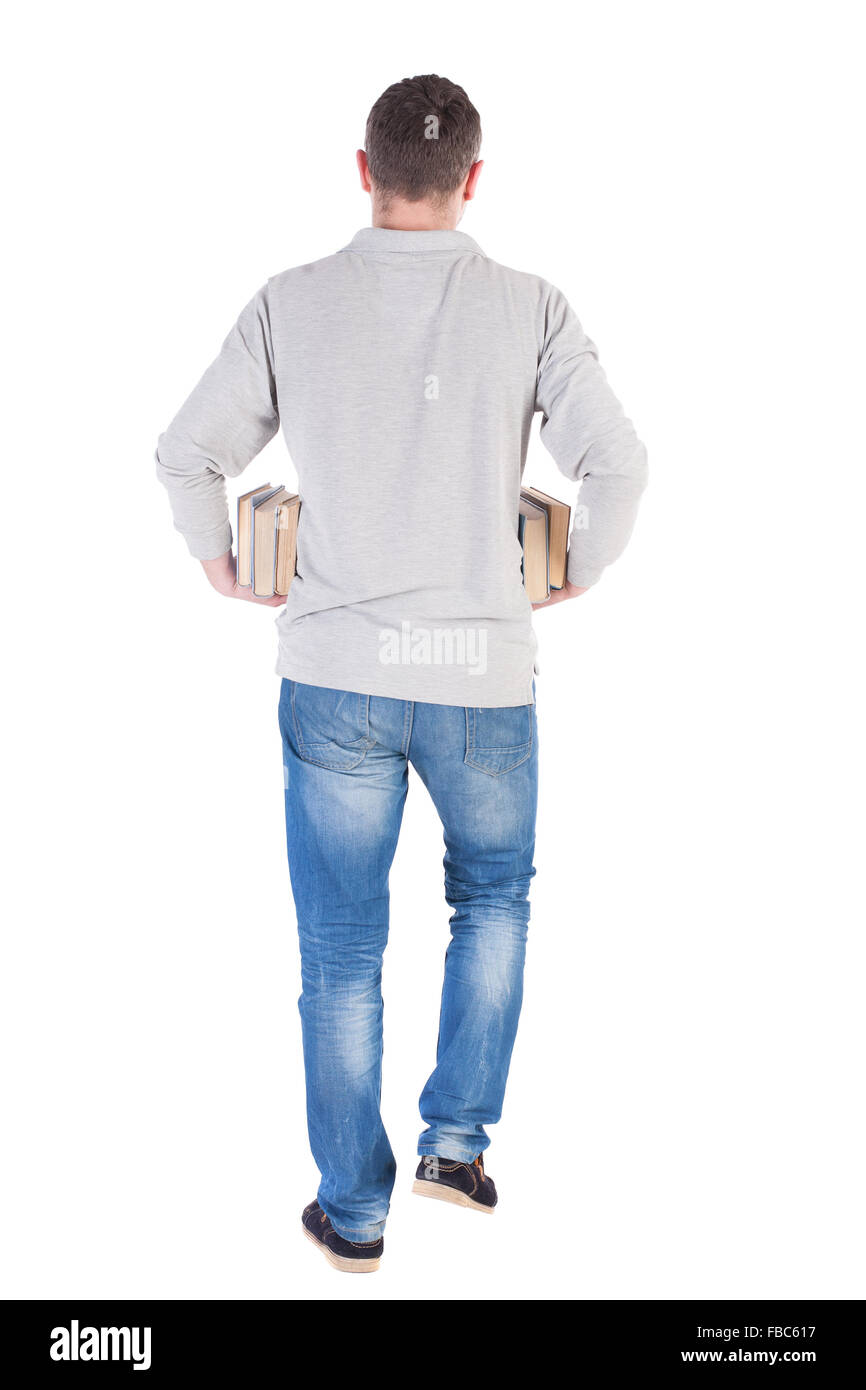 man goes and has a stack of books. back view. Rear view people ...