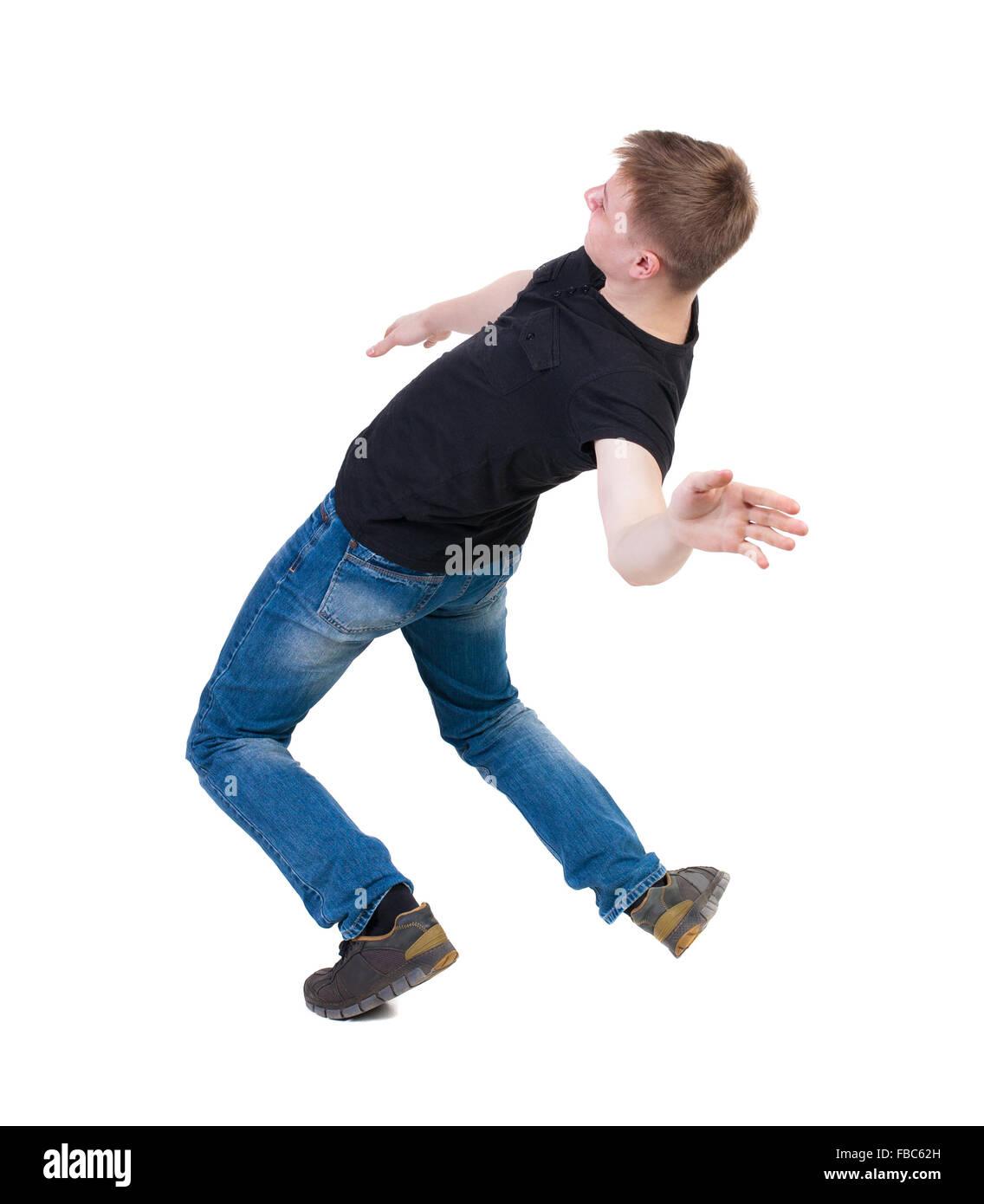 Balancing young man. or dodge the falling man. Rear view people ...