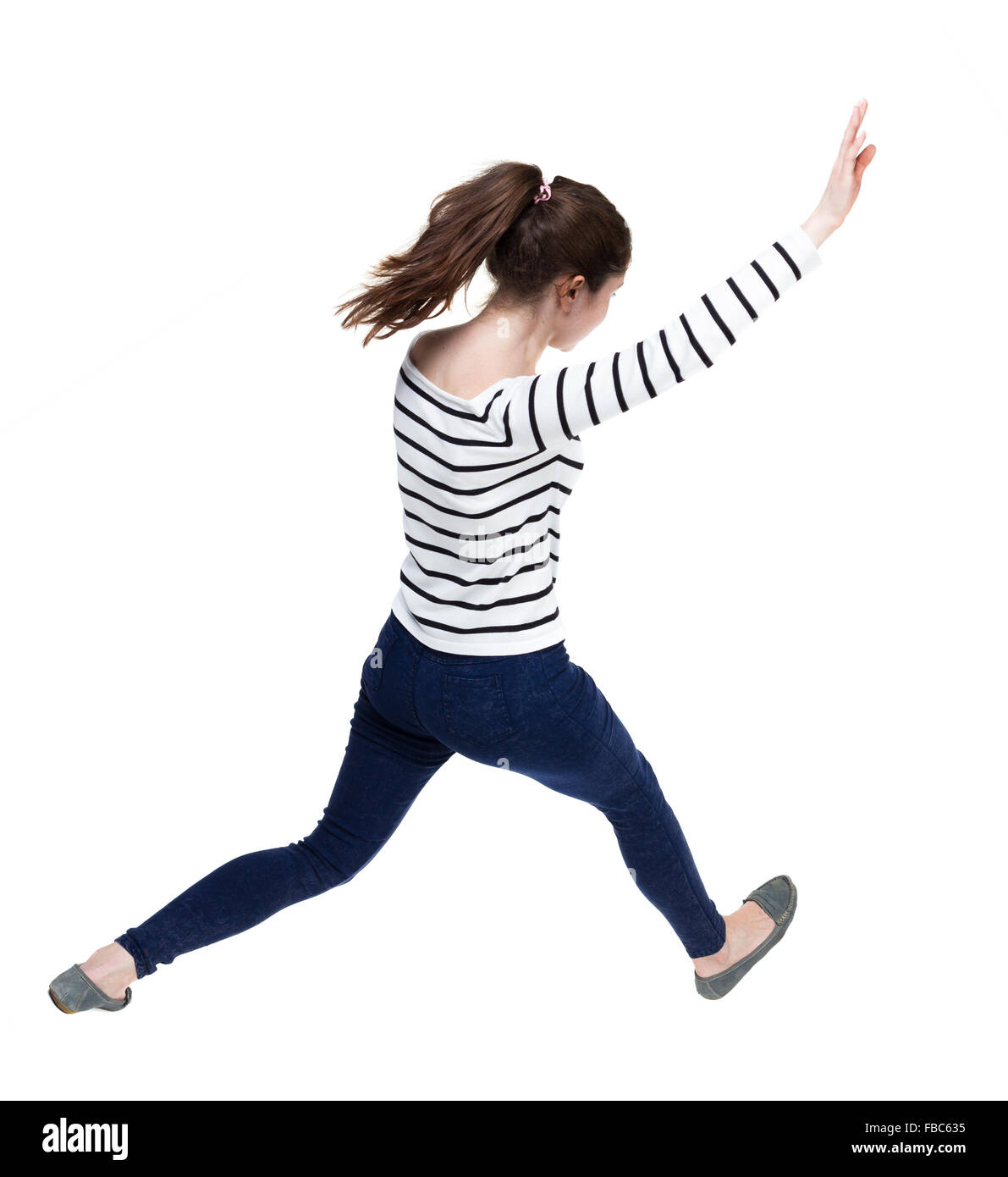 Balancing young woman. or dodge falling woman. Rear view people ...