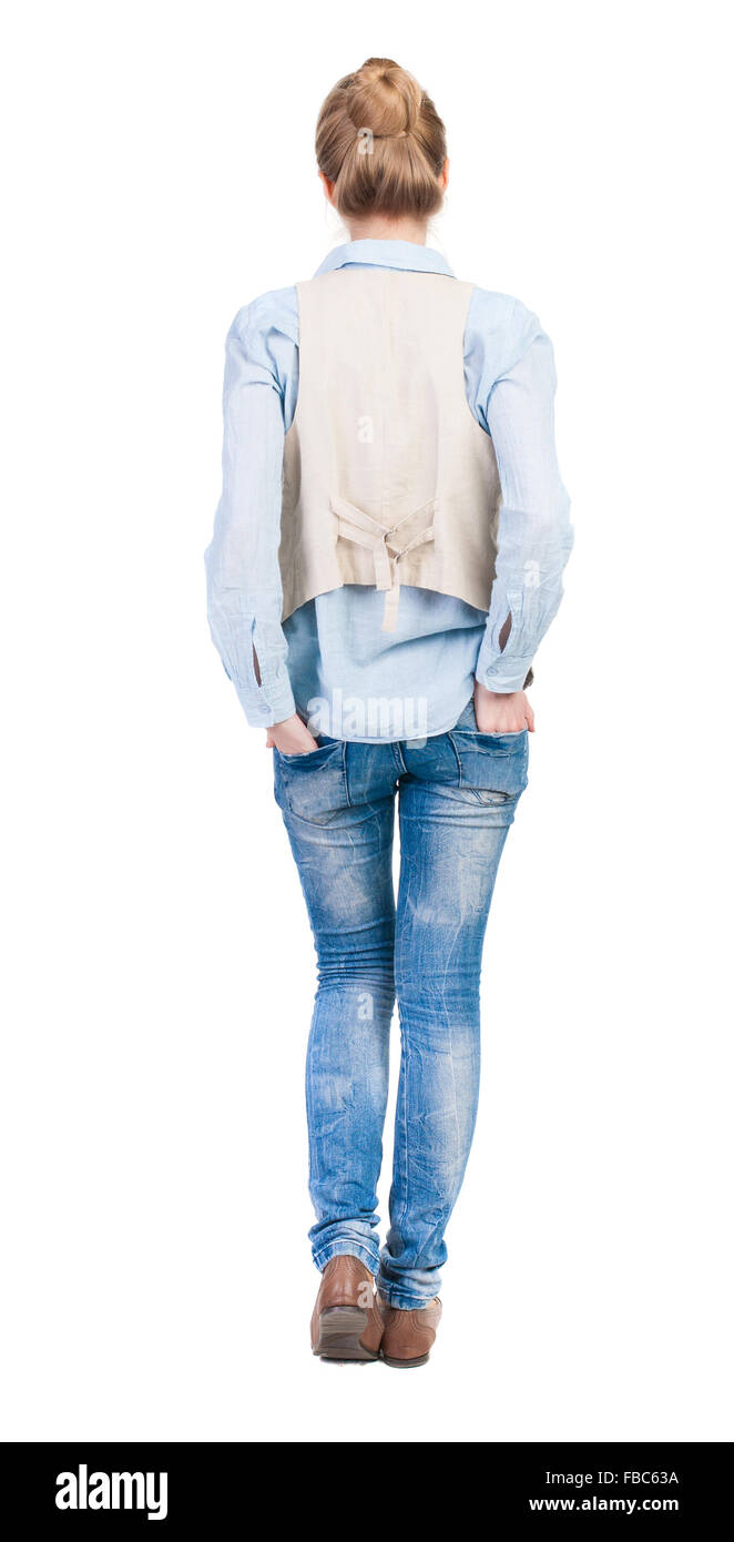 back view of standing young beautiful blonde woman in brown vest. girl ...