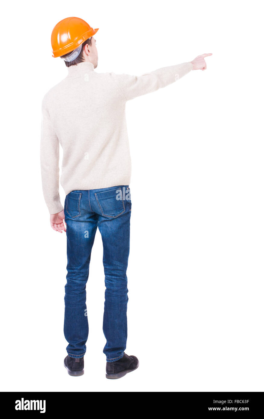 Back view of pointing young men in helmet. Young guy gesture. Rear view ...