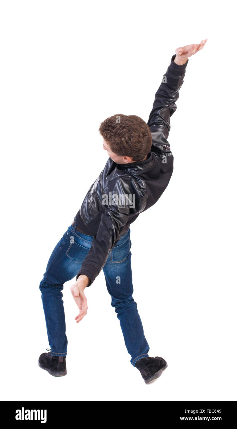 Balancing young man or dodge falling man. Rear view people collection ...