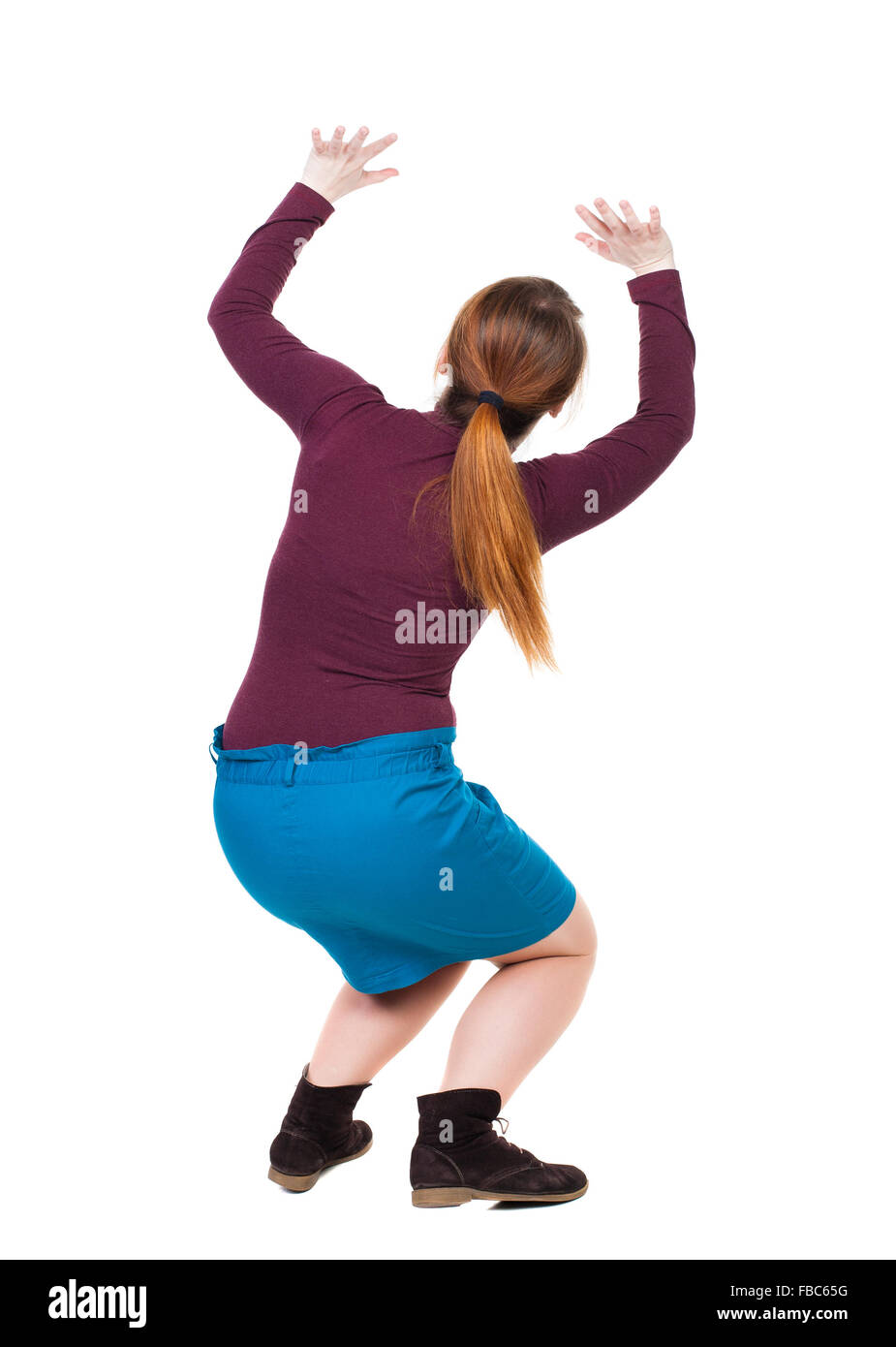 back view of woman protects hands from what is falling from above. Man ...