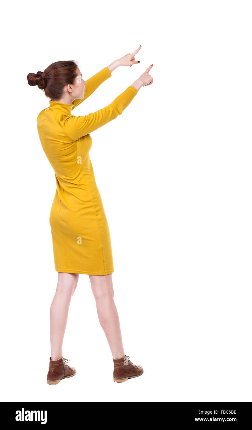 Back view of pointing woman. beautiful girl. Rear view people ...