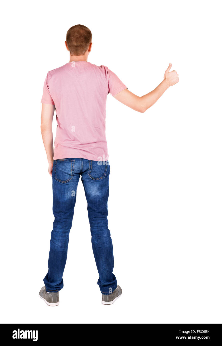 Back view of man in t-shirt. shows thumbs up. Rear view people ...