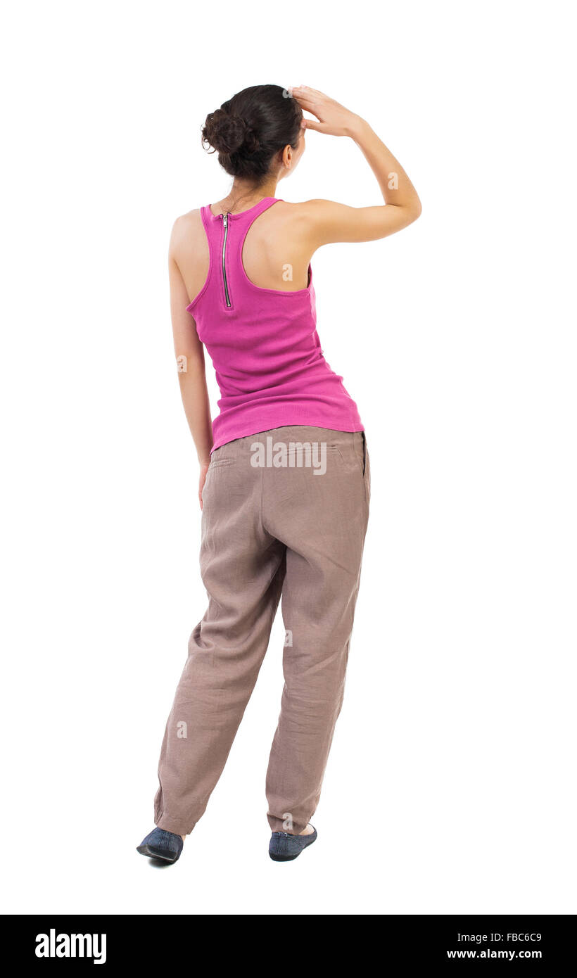 back view of standing young beautiful woman. girl watching. Rear view ...