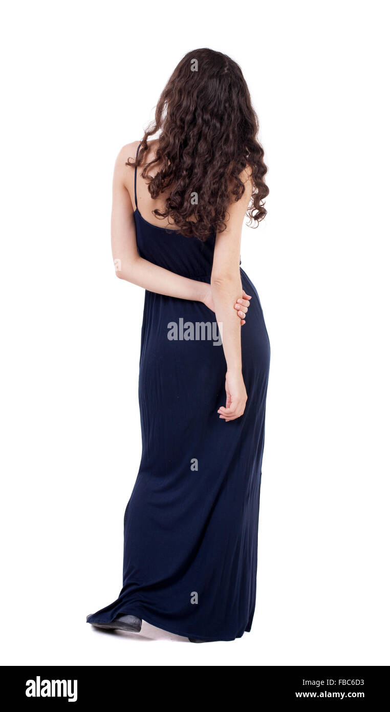 back view of standing young beautiful woman. girl watching. Rear view ...