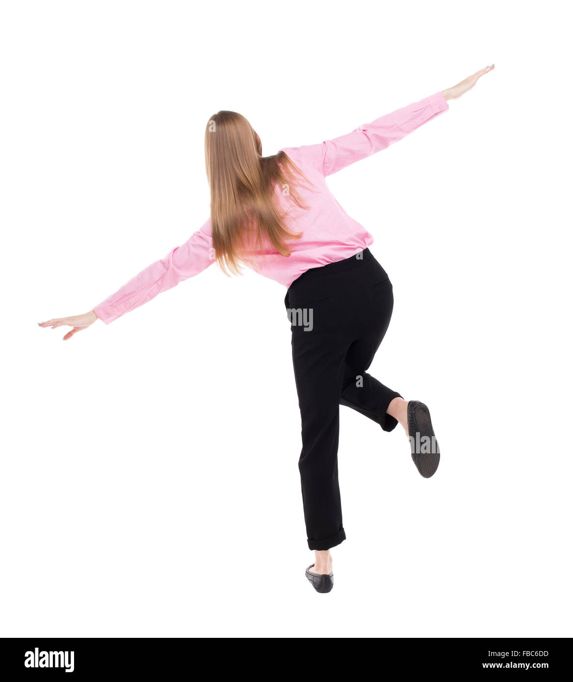 Balancing young business woman. or dodge falling woman. Rear view ...