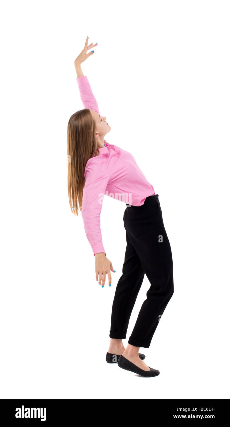 Balancing young business woman. or dodge falling woman. Rear view ...