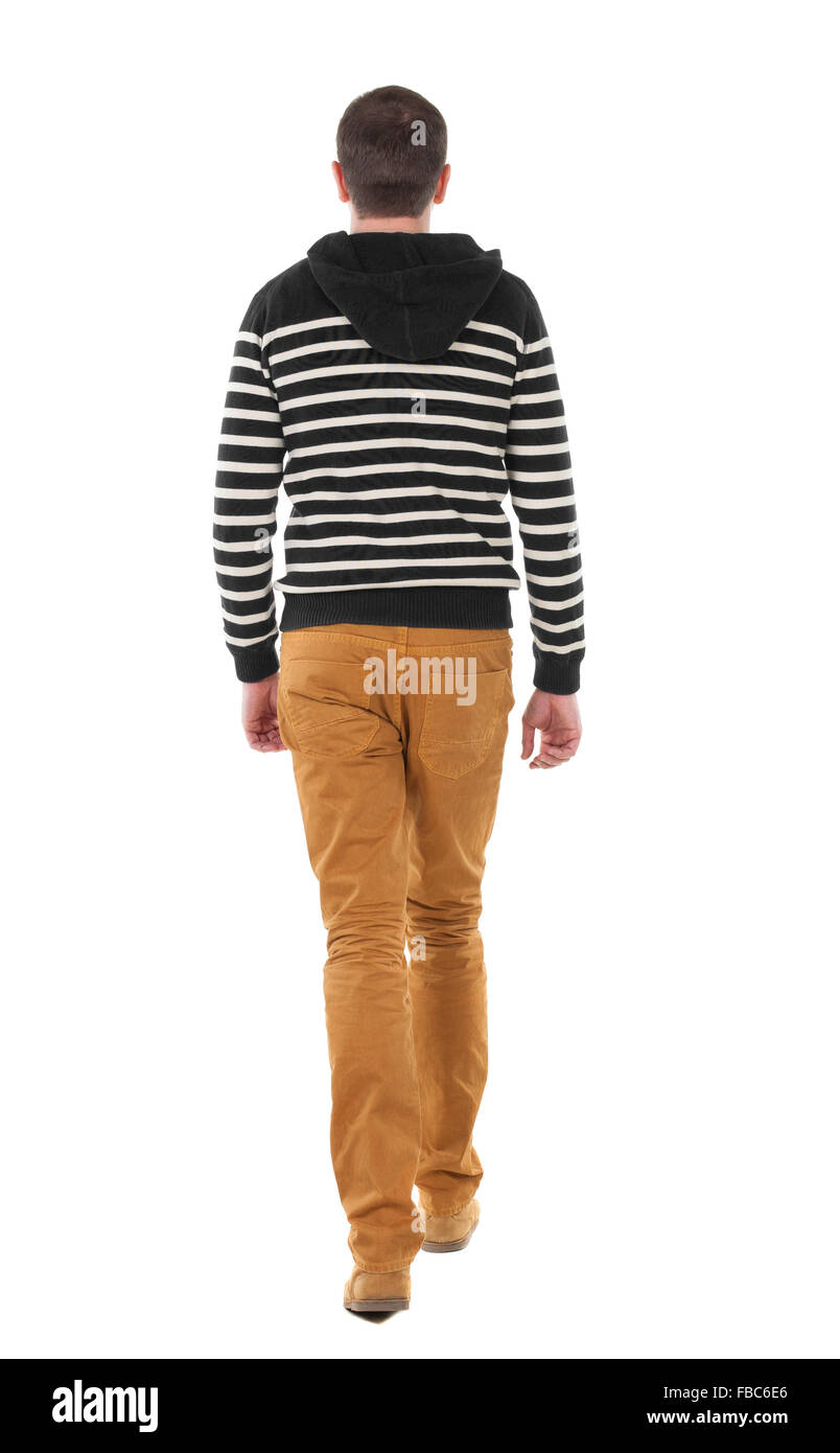 Back view of going handsome man in jeans and striped sweater. walking ...