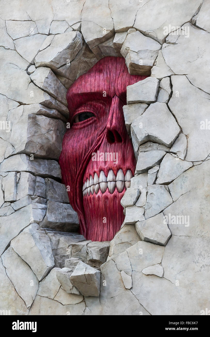 A Colosal Titan's face on display at Universal Studios Japan on January ...