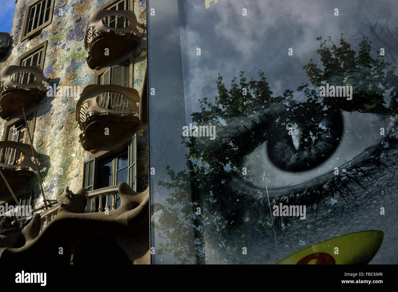 A watchful eye from a bus shelter poster outside Gaudi's Casa Batllo ...