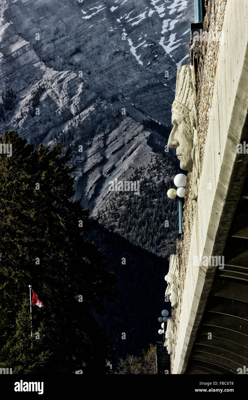 Native American Indian head carvings on the side of Bow River Bridge ...