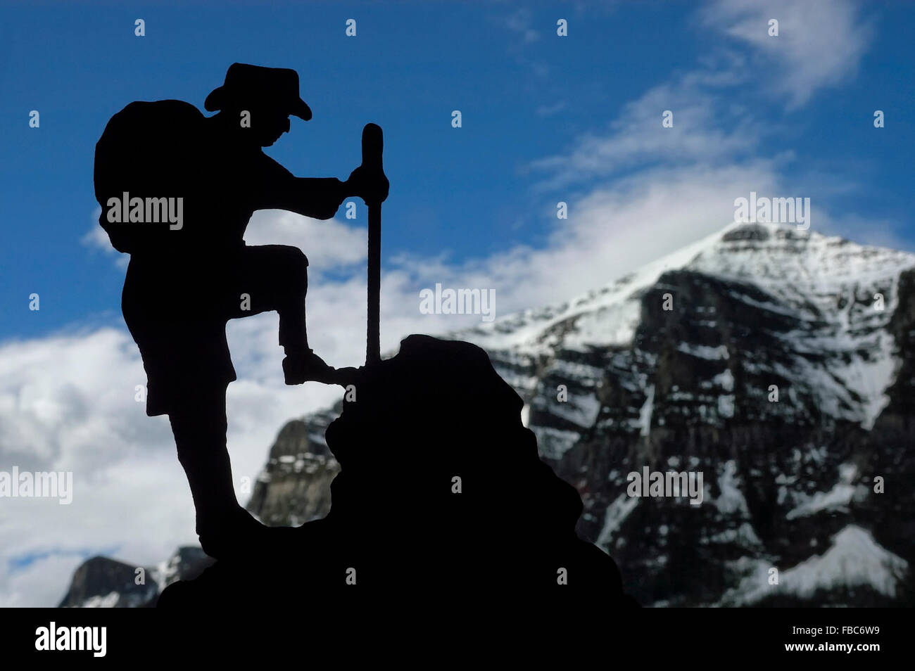 Mountain hiker statue and view from inside Chateau Lake Louise. Alberta ...