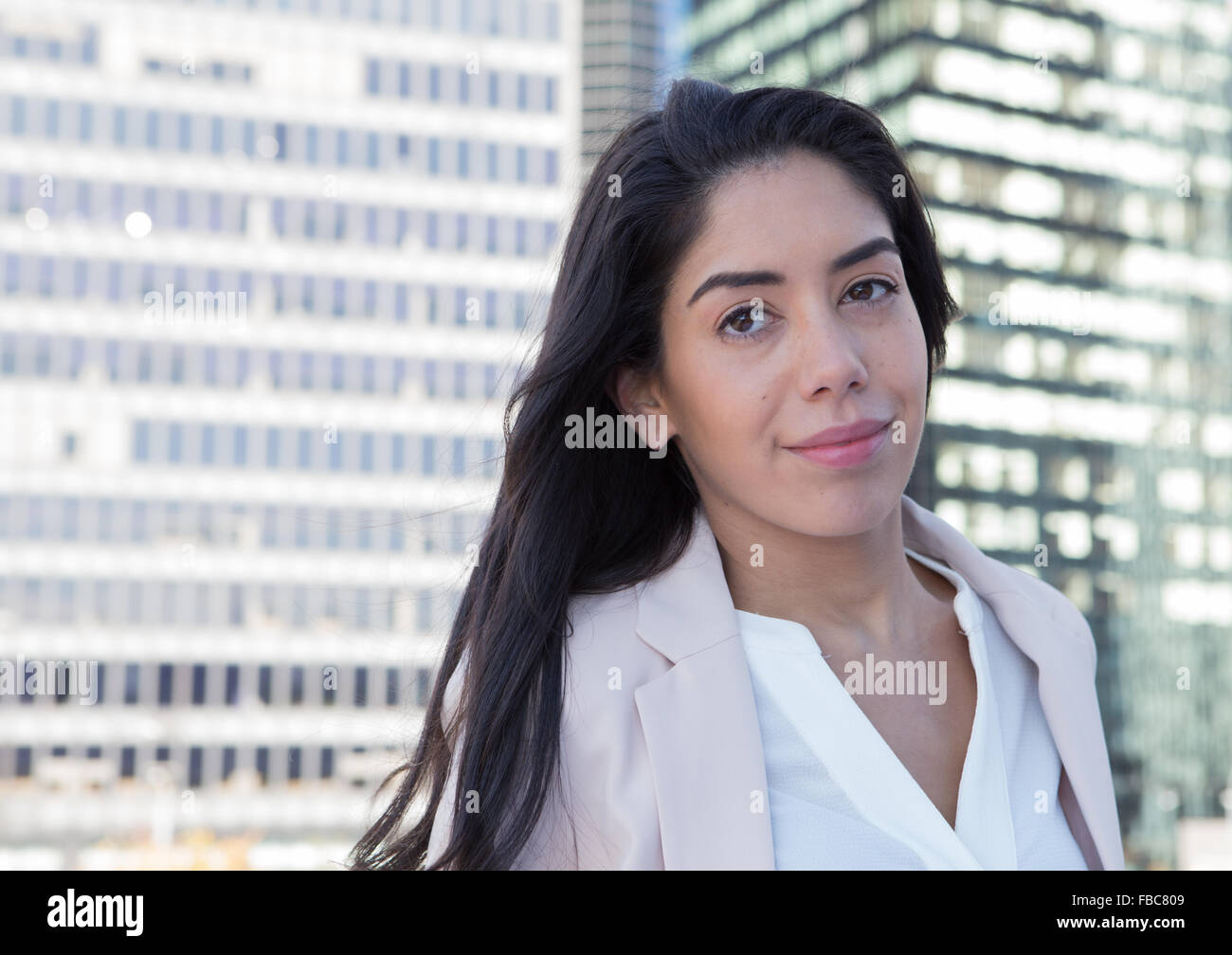 Young Latin professional woman in the city. Photographed in New York ...