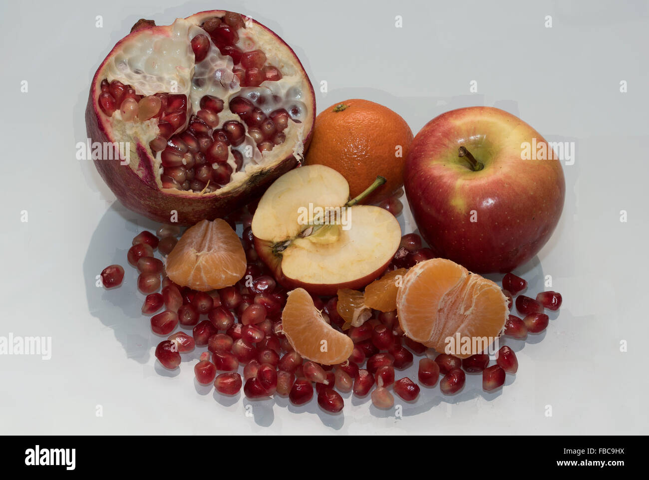 healthy sweet apple garnet and mandarin Stock Photo - Alamy