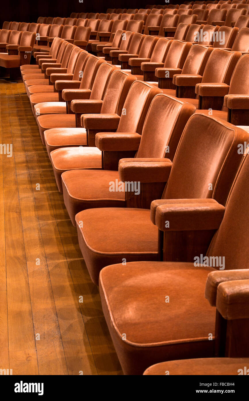 Rows of brown theater seats in a concert hall Stock Photo - Alamy
