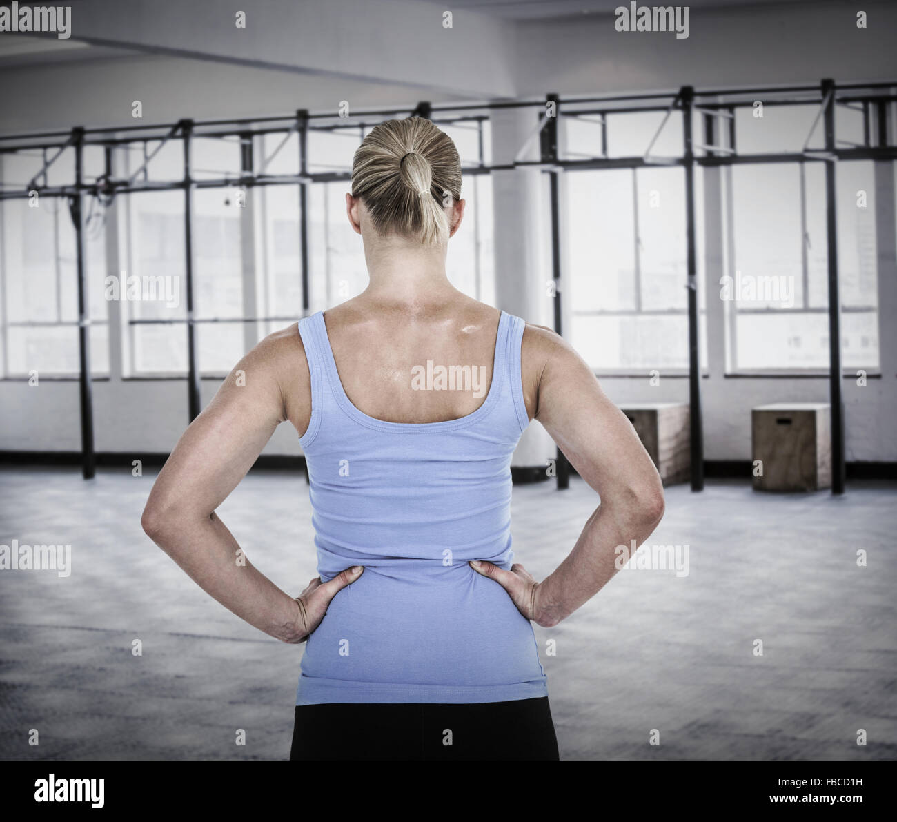 Composite image of back view of muscular woman Stock Photo - Alamy