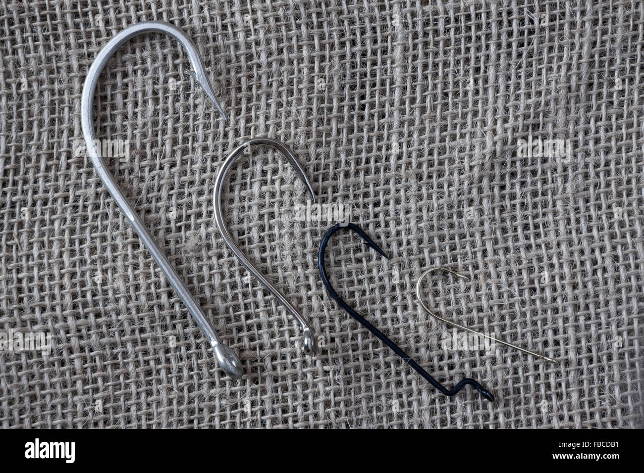 Various vintage fishing hooks on a vintage type background Stock Photo ...