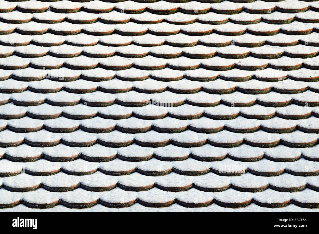 Tile roof, covered with white snow. Winter background Stock Photo - Alamy