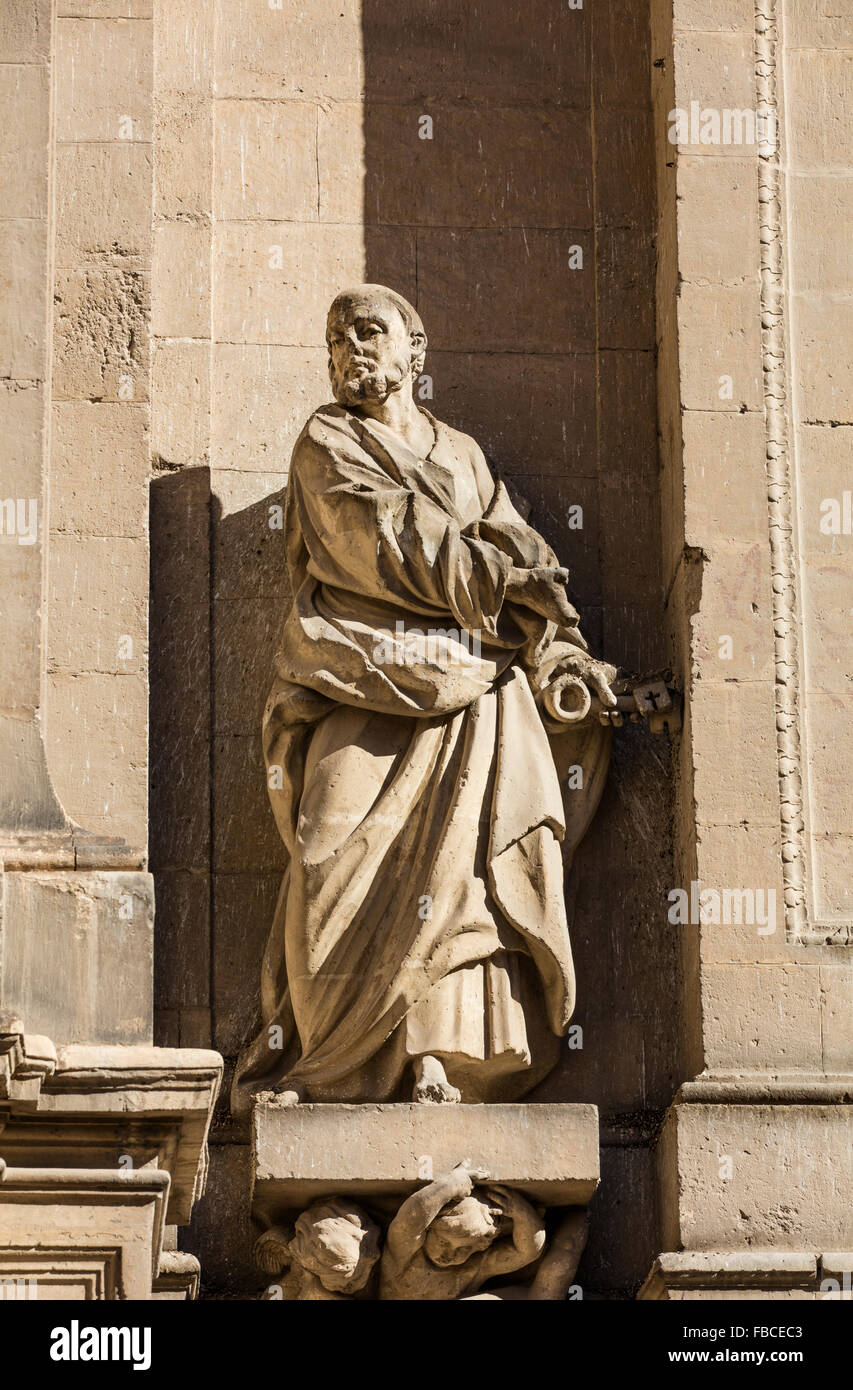 Statue in an alcove of Granada Cathedral in Spain in glorious sunlight ...