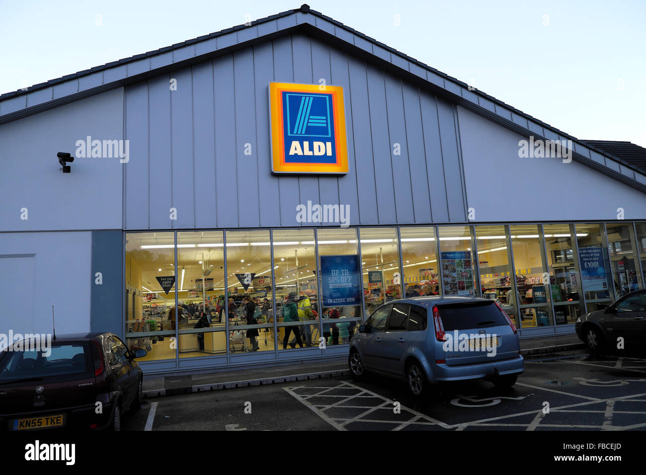Exterior view of customers shopping inside the Aldi Supermarket store ...