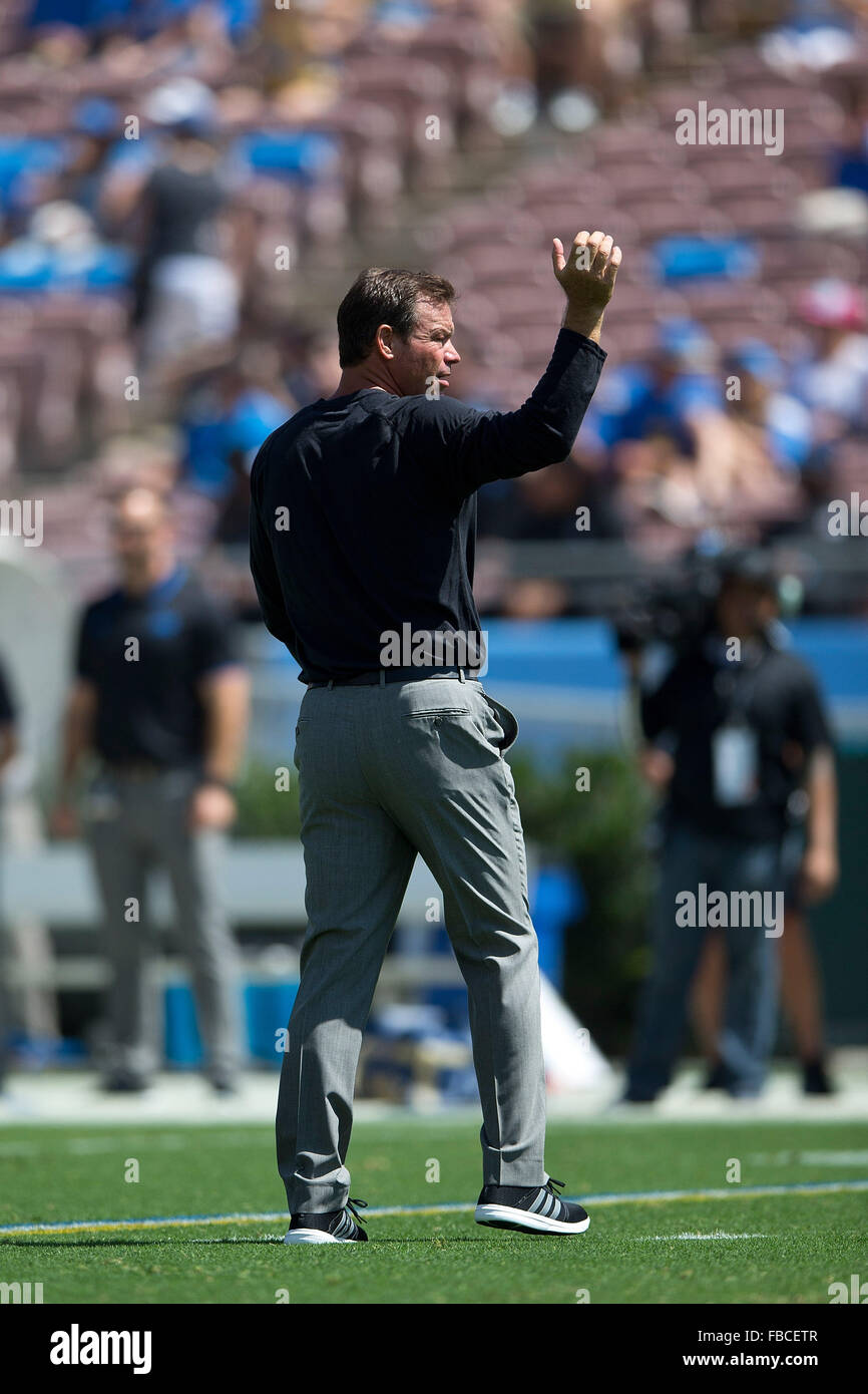 Head coach Jim Mora of the UCLA Bruins stands on the field before the ...