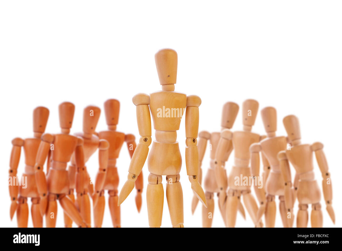 Wooden dummy character standing between two different colored teams ...