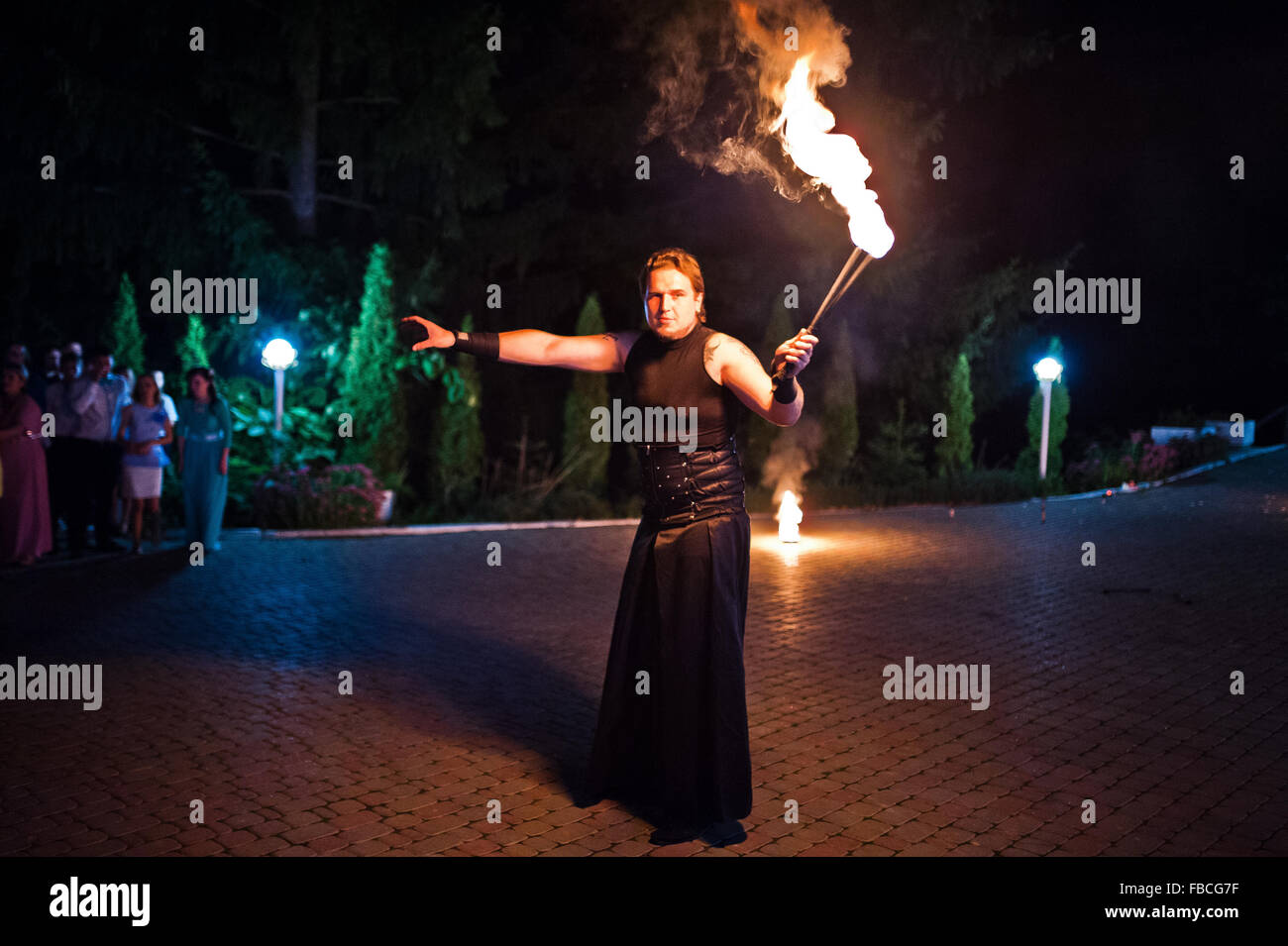 Amazing fire show on wedding ceremony at night Stock Photo - Alamy
