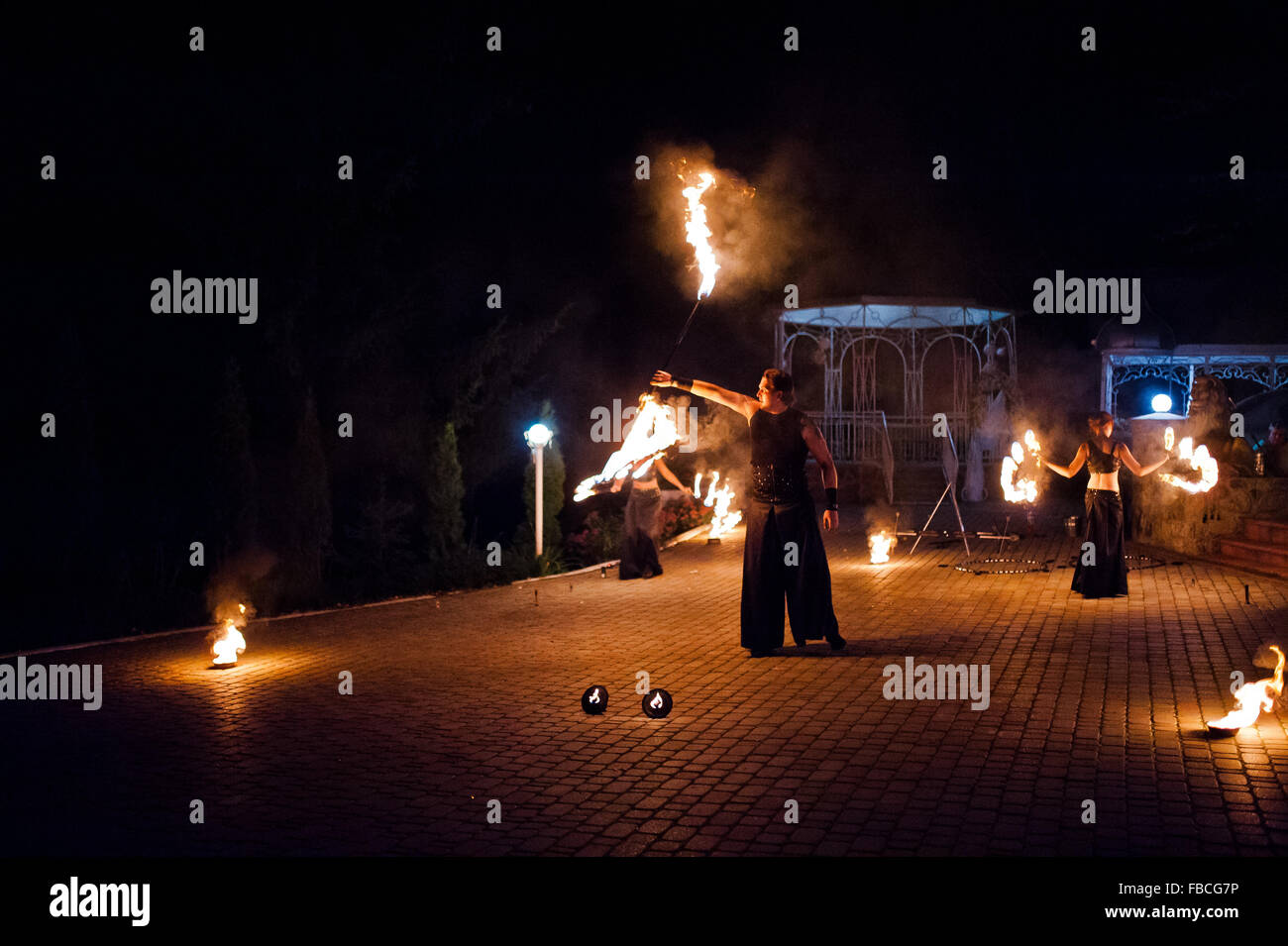 Amazing fire show on wedding ceremony at night Stock Photo - Alamy