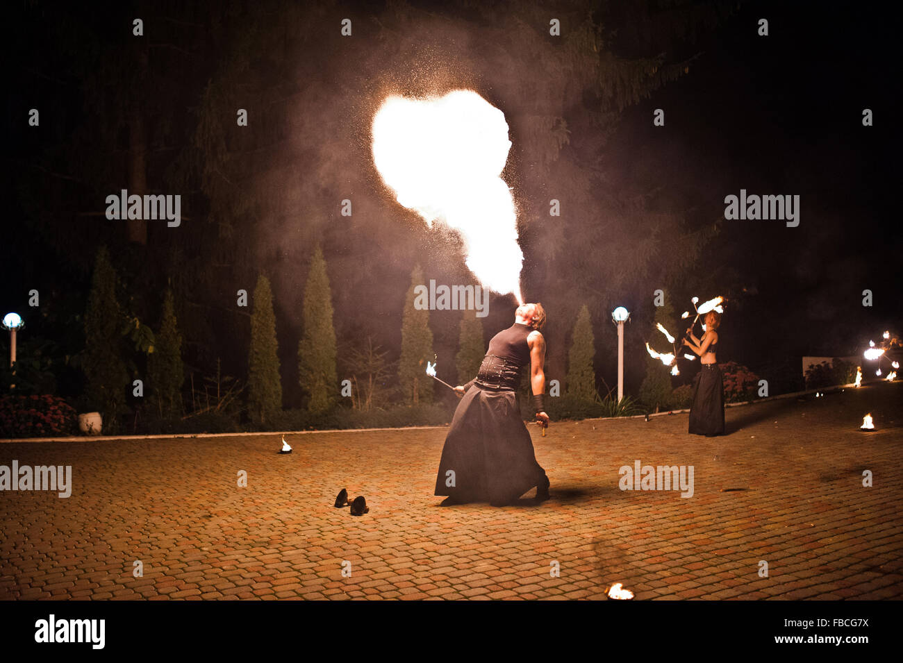 Amazing fire show on wedding ceremony at night Stock Photo - Alamy