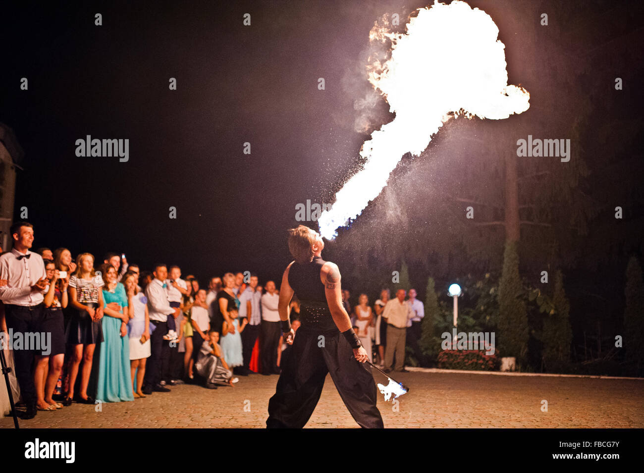 Amazing fire show on wedding ceremony at night Stock Photo - Alamy