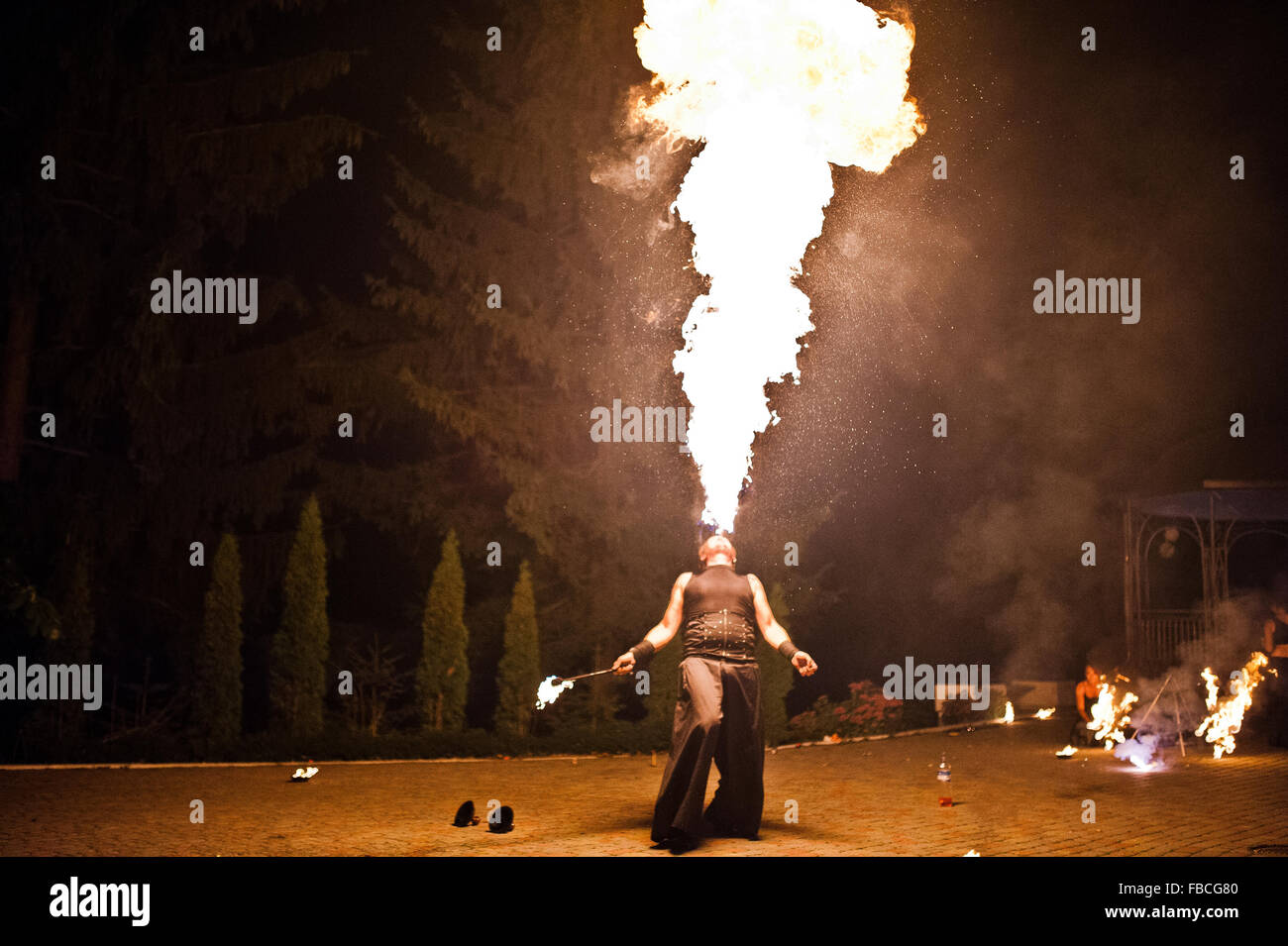 Amazing fire show on wedding ceremony at night Stock Photo - Alamy