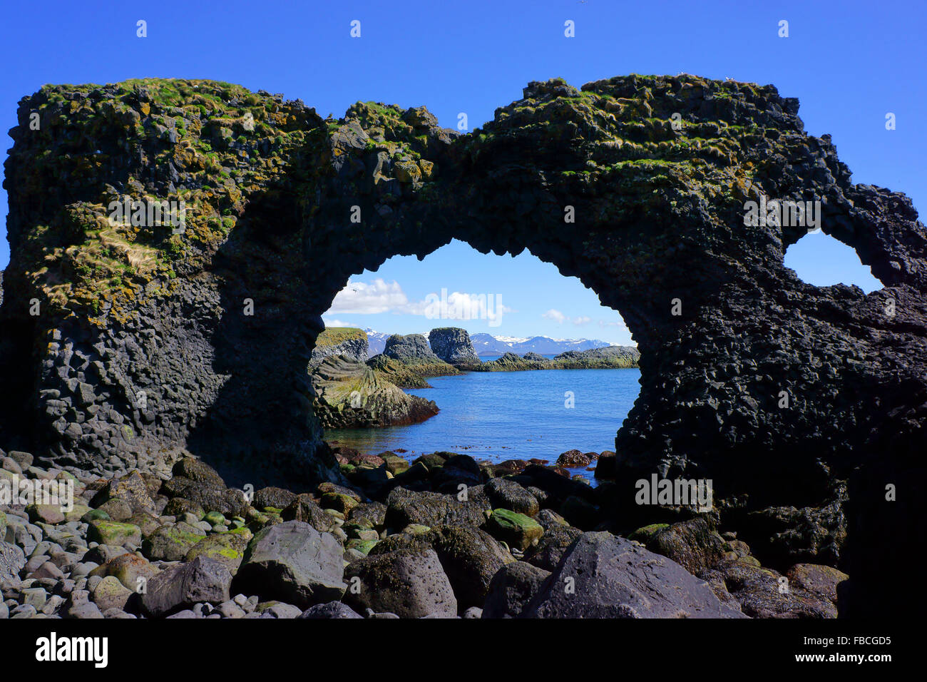 Shoreline and cliffs of basalt rock at Arnarstapi nature reserve seen ...