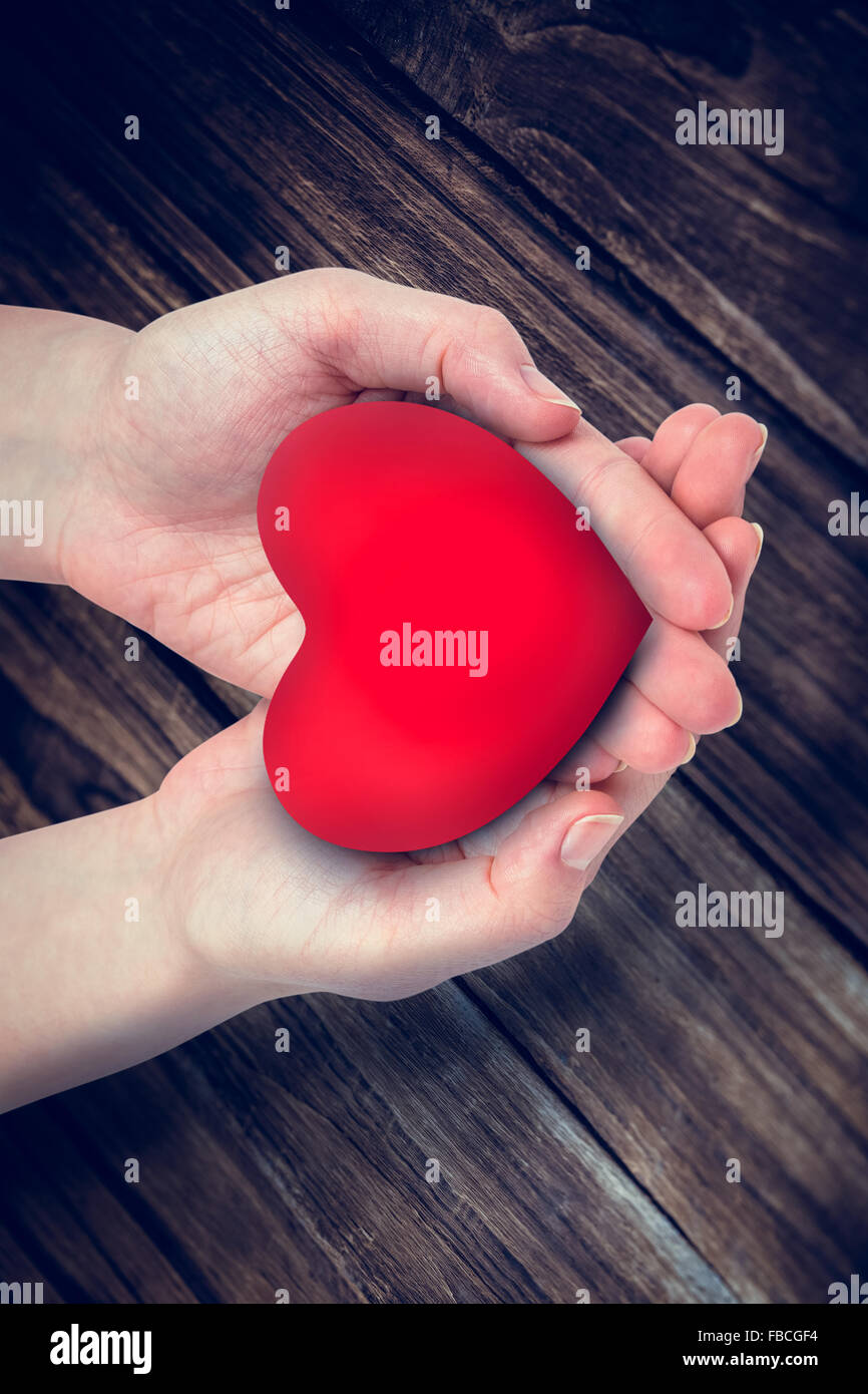 Composite image of hand showing heart Stock Photo - Alamy