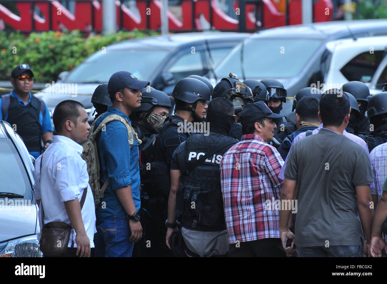 Indonesian police officers take security measures near the location of ...